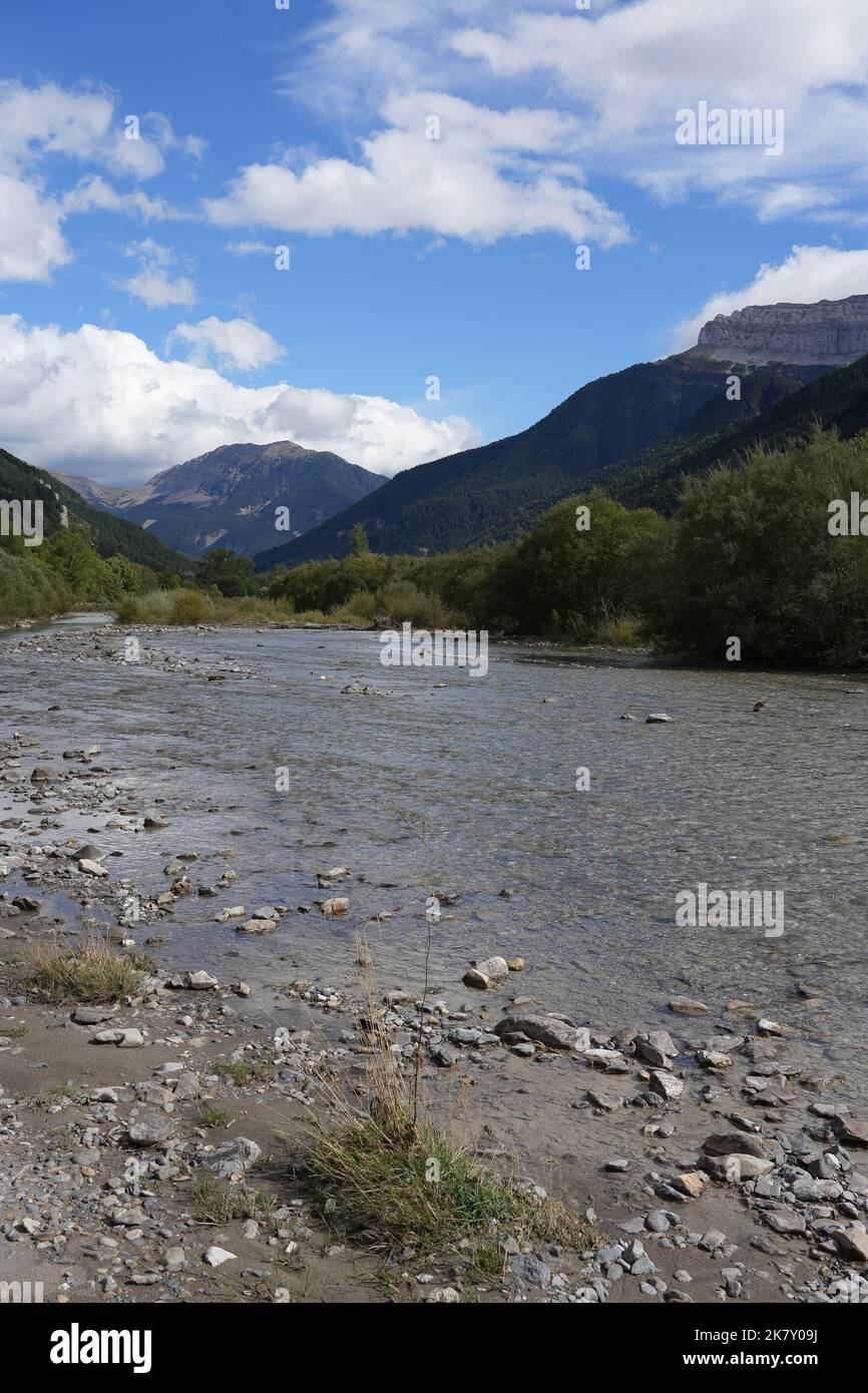 magnificent view of a river flowing through a valley sided by Spanish ...