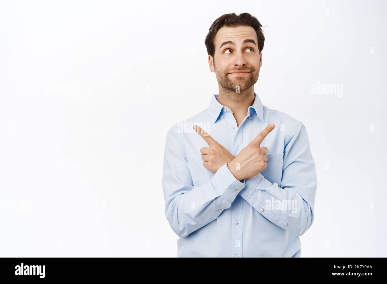 Confused adult man pointing sideways, left and right direction ...