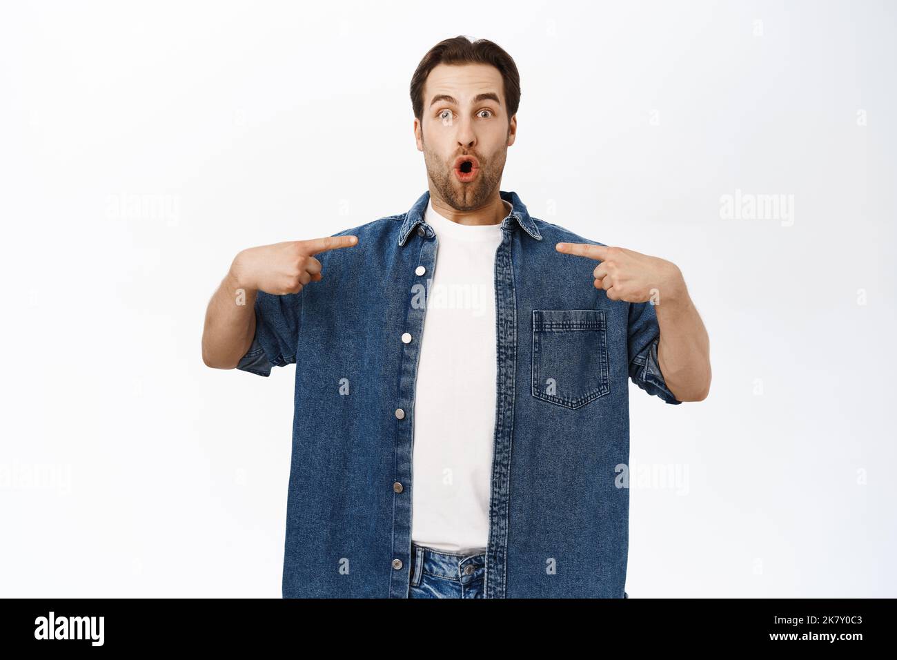 Enthusiastic man points at himself with happy smile, self-promoting ...