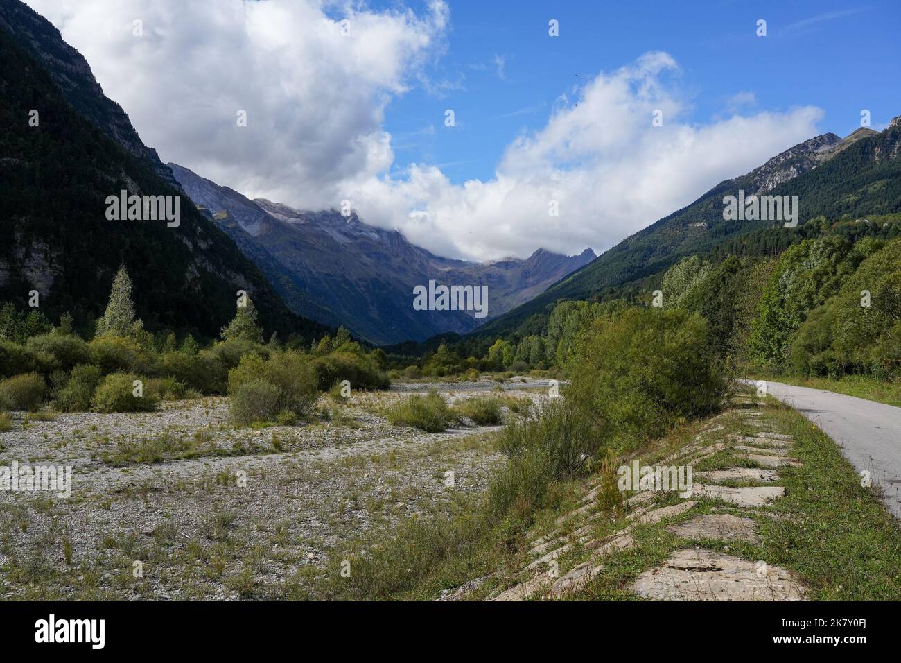 magnificent view of a river flowing through a valley sided by Spanish ...