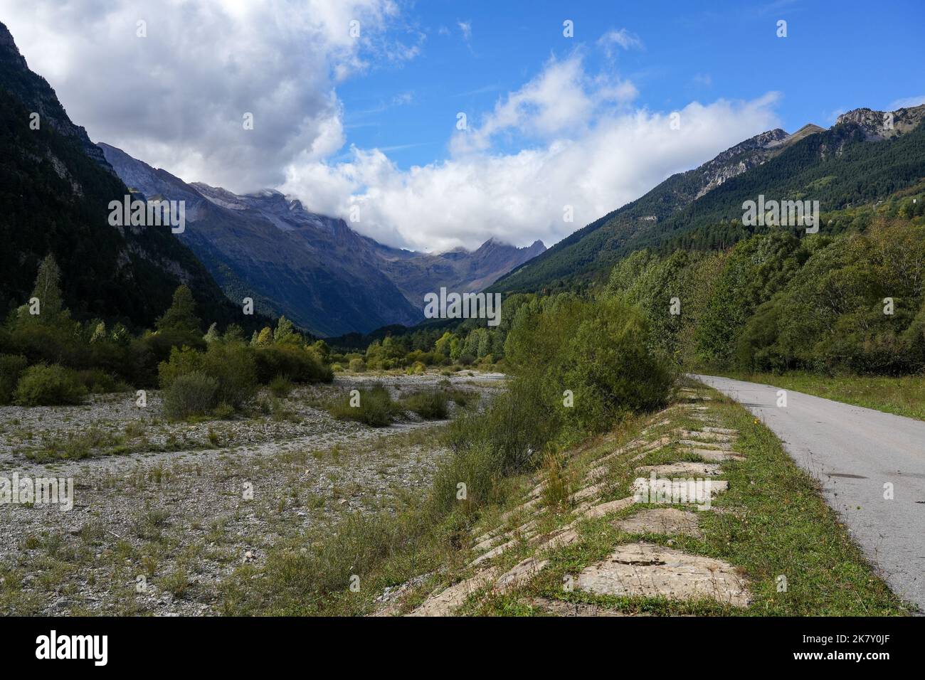 magnificent view of a river flowing through a valley sided by Spanish ...