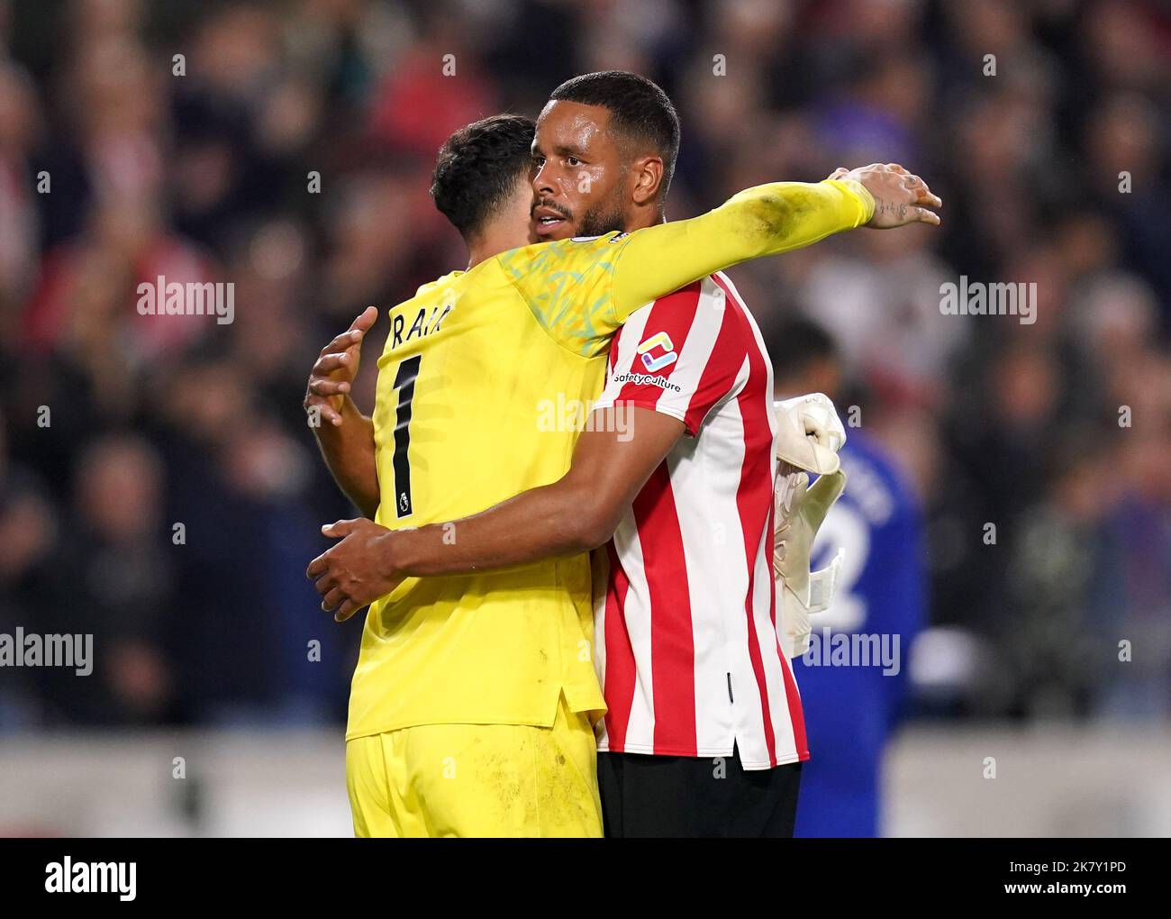 Brentford goalkeeper David Raya embraces team-mate Mathias Jorgensen ...