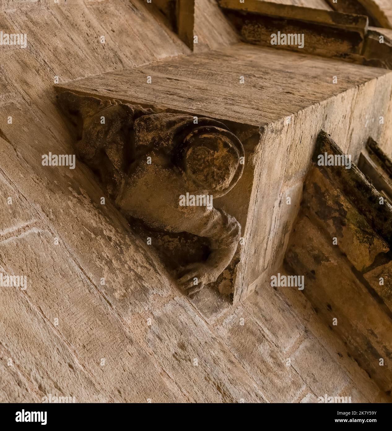 a stone grotesque embelishment on the base of a church parapet Stock ...
