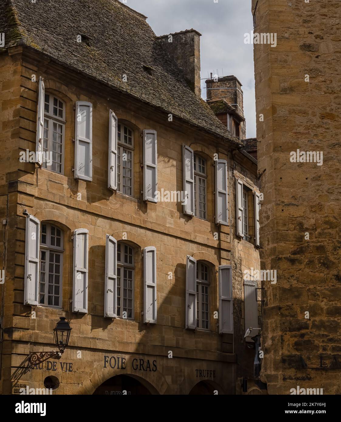 view of 14th century medieval town buildings in Sarlat-la-Caneda ...