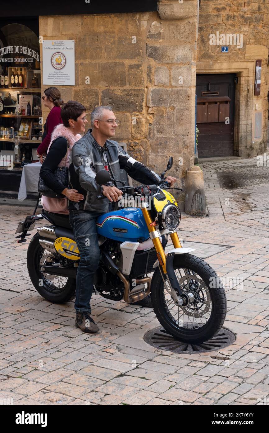 A Caballero 500 motorbike entering the Sarlat-la-Caneda town centre classic car and bike show ...