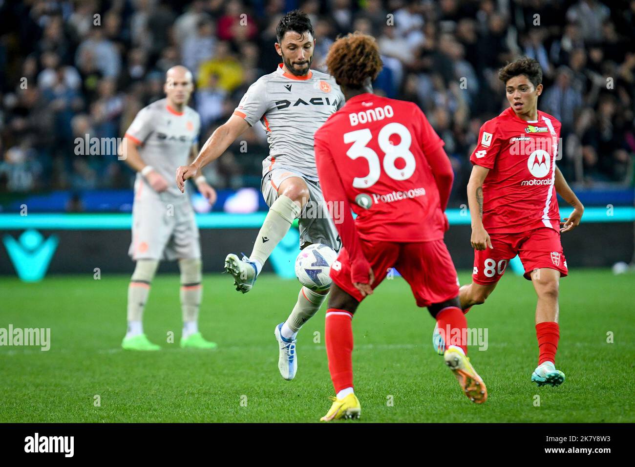 Udinese's Tolgay Arslan in action hindered by Monza's Warren Bondo during the Italian football ...