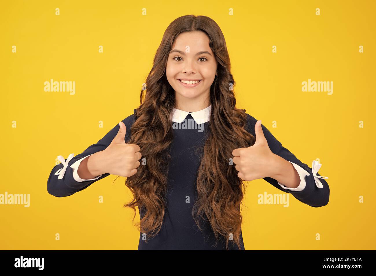 Children gesture. Happy teenager kid girl in casual clothes showing ...