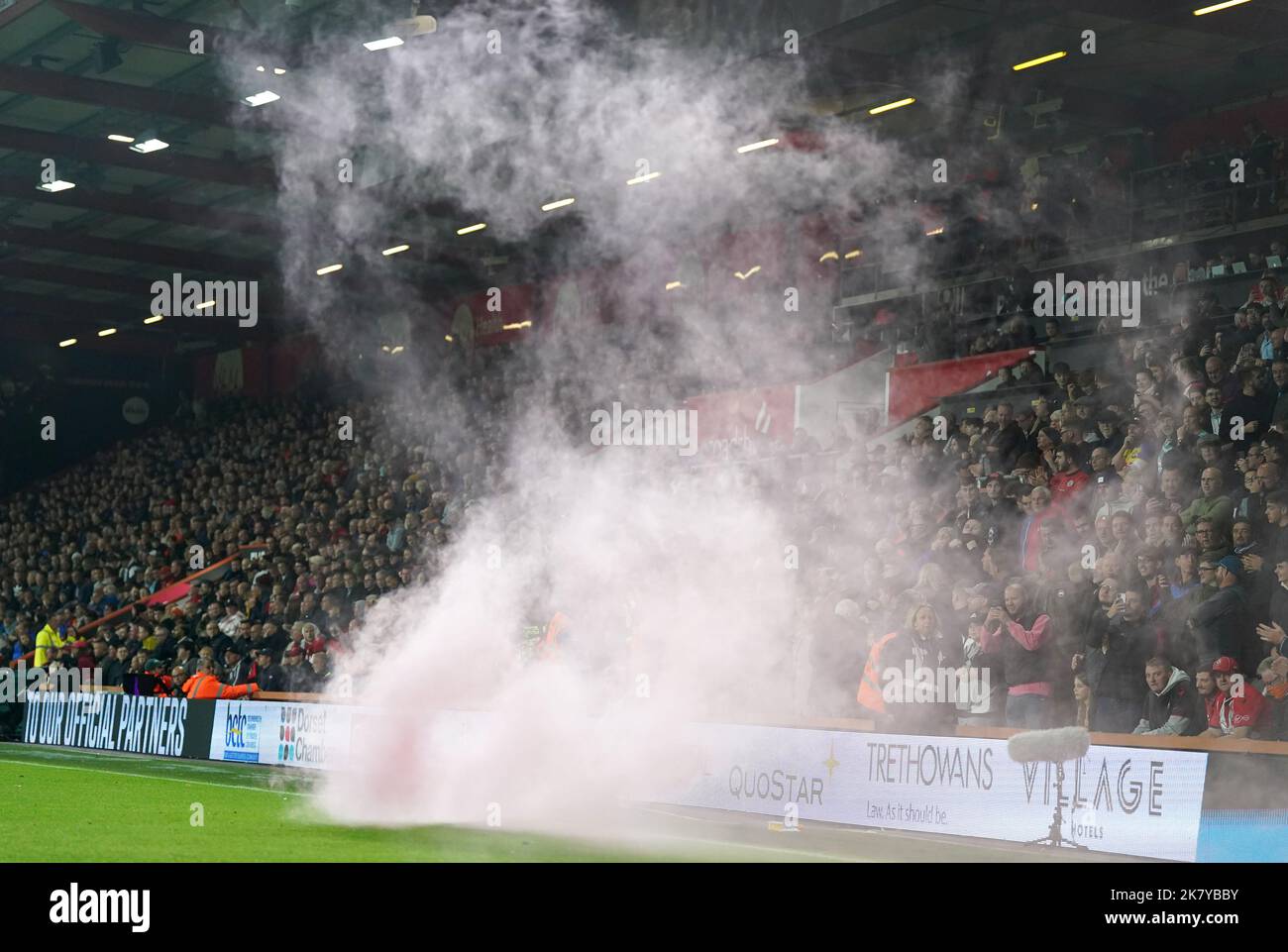A smoke flare that was thrown onto the pitch by Southampton fans during ...