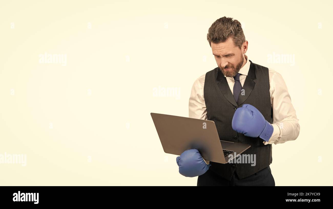 confused man boss hold laptop in boxing gloves. anger management. cyber ...