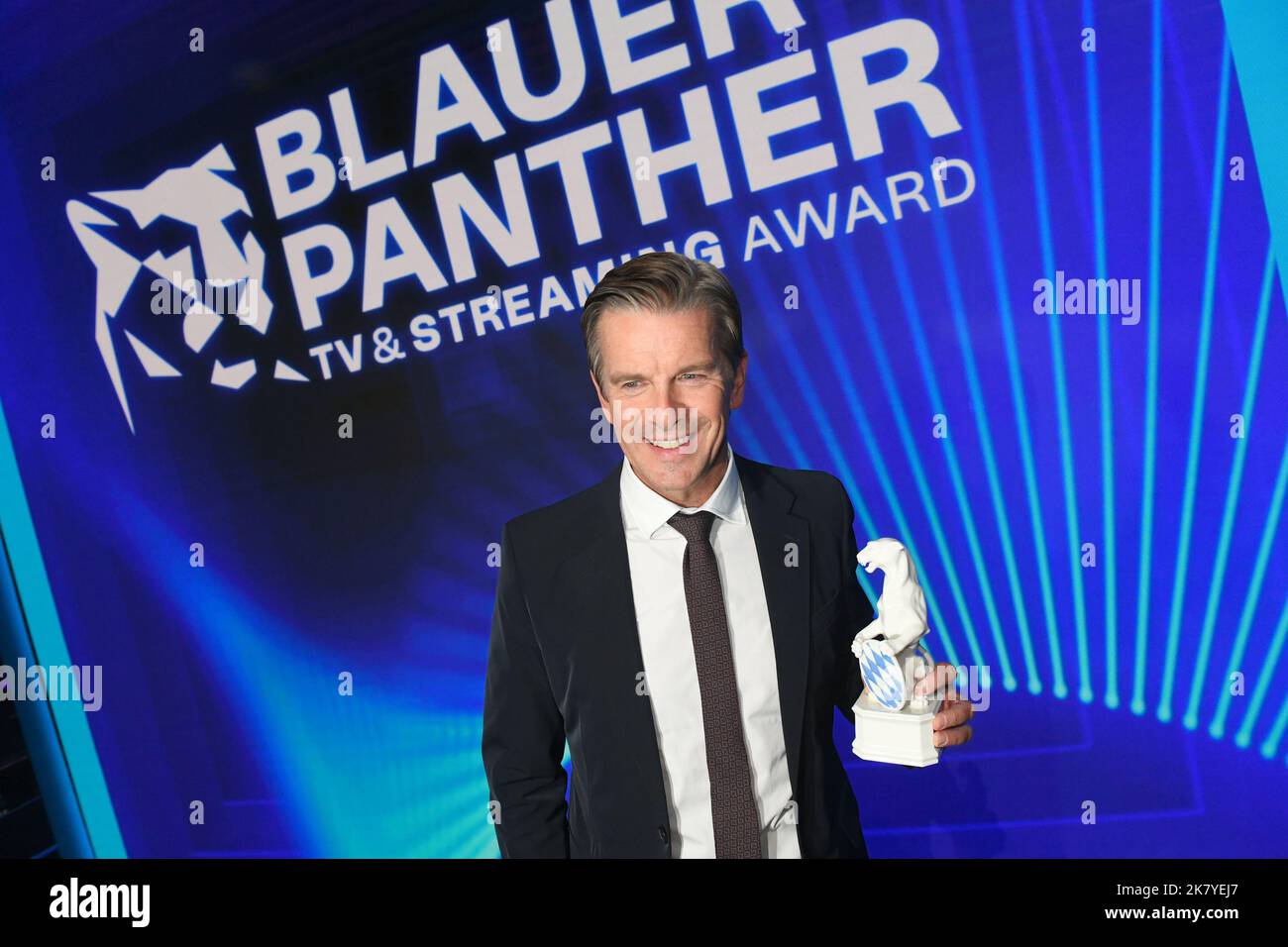 Munich, Germany. 19th Oct, 2022. Presenter Markus Lanz holds his award ...