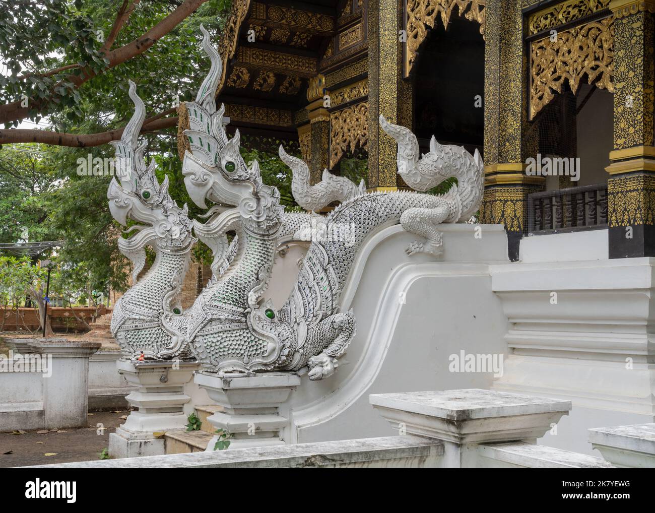 Traditional white stucco naga stairs entrance to a religious building ...