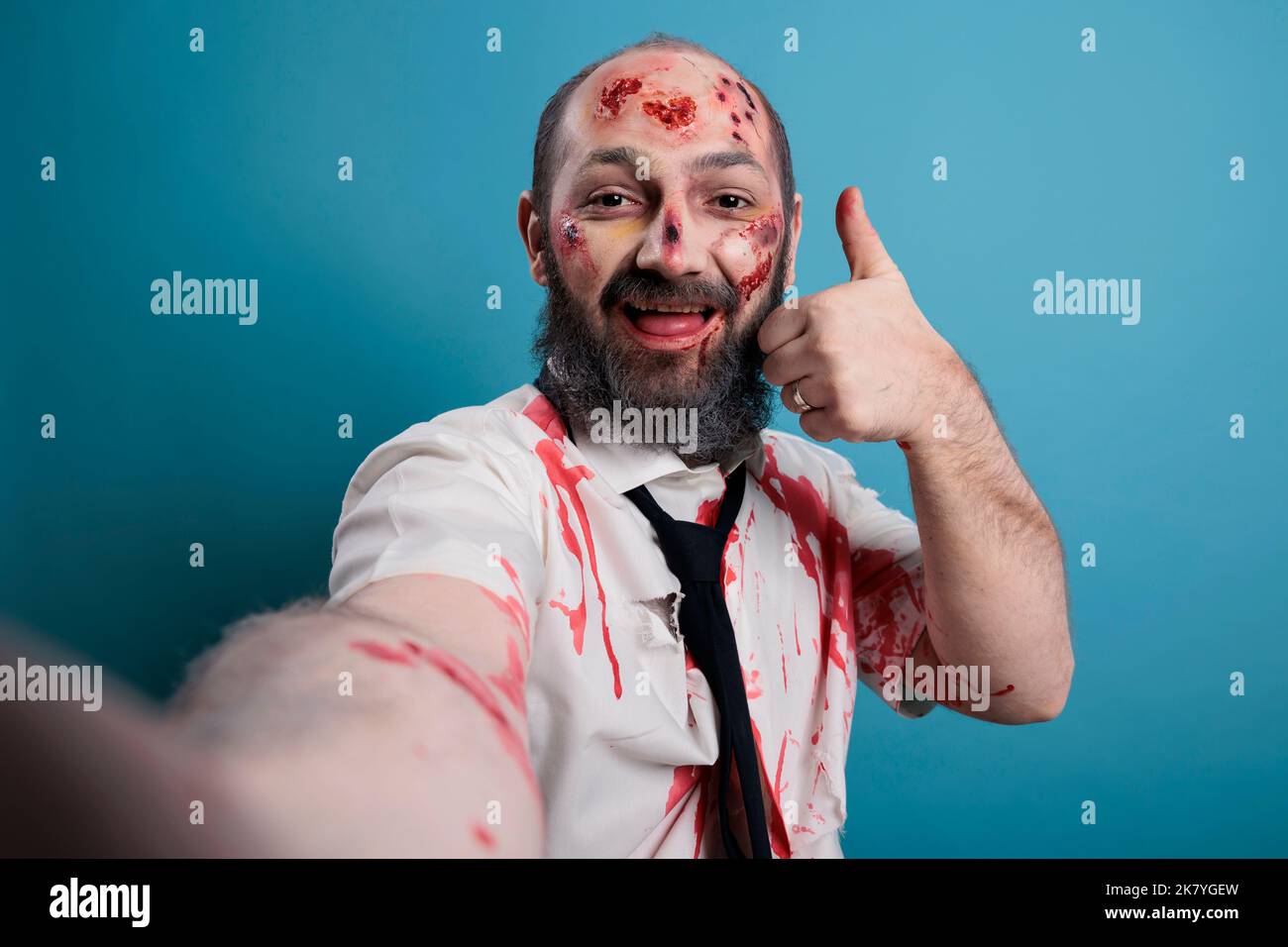 Apocalyptic monster doing thumbs up sign in front of camera, taking ...