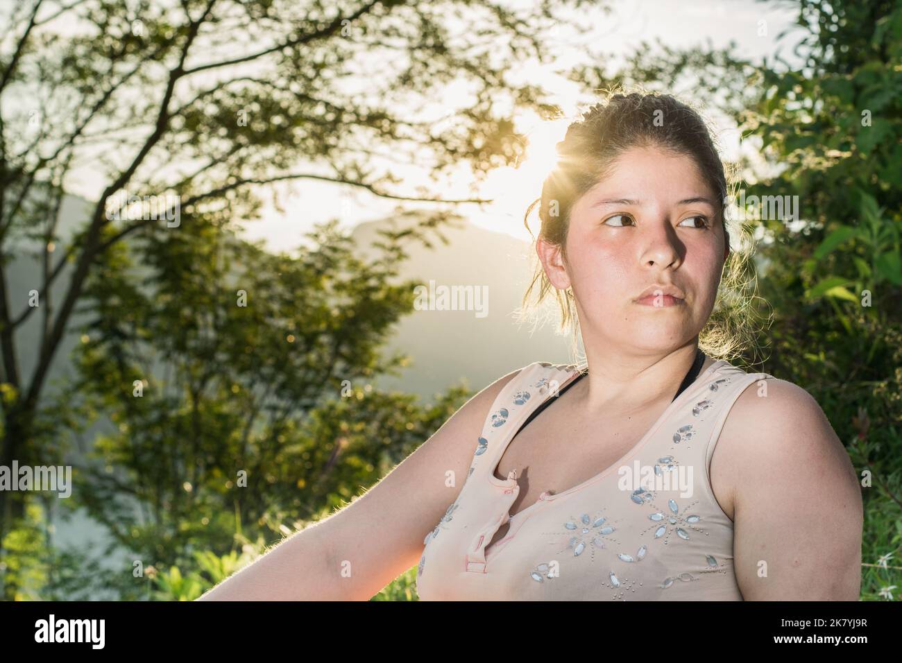 beautiful young woman, latina college student walking in nature ...
