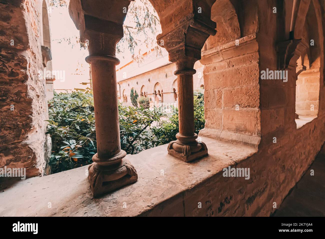 Inner courtyard of a medieval monastery with arches and columns Stock ...
