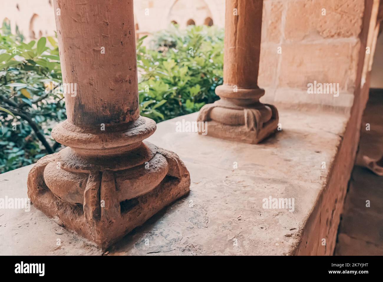 Inner courtyard of a medieval monastery with arches and columns Stock ...