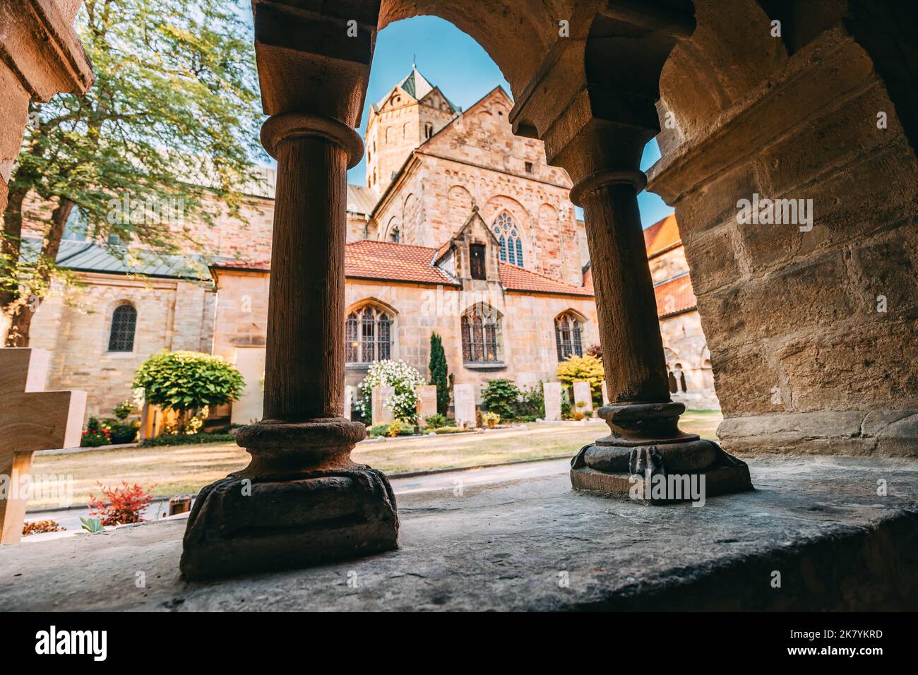 Inner courtyard of a medieval monastery with arches and columns. Small ...