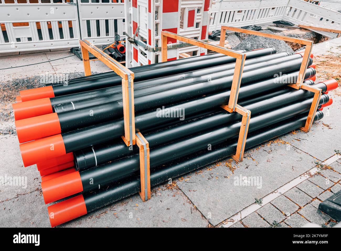 Excavation on a city street to replace plastic water pipes or laying ...