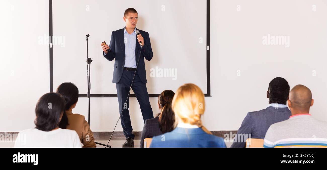 Student speaking in to microphone hi-res stock photography and images ...
