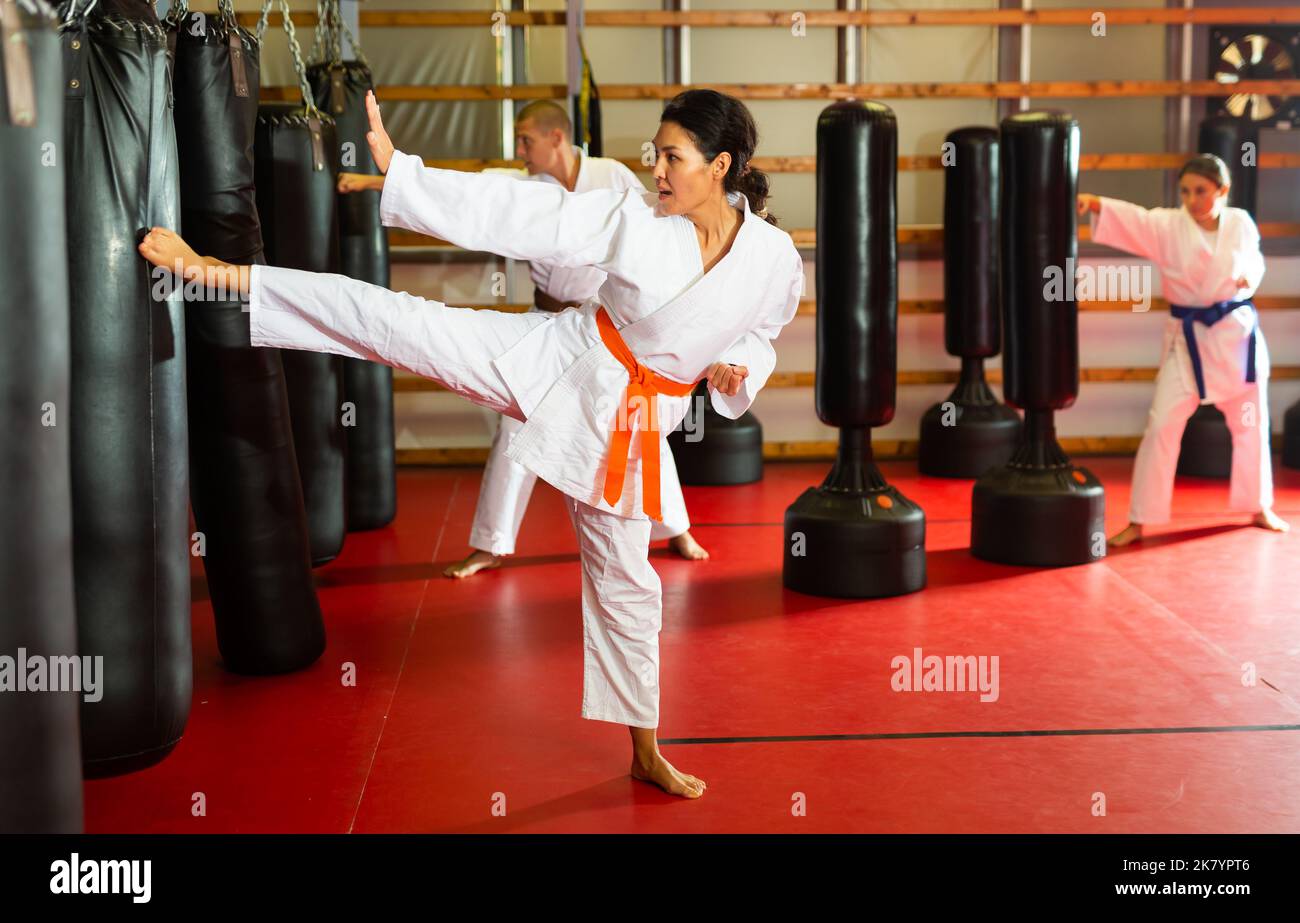 Asian Woman is practicing different kicks Stock Photo - Alamy