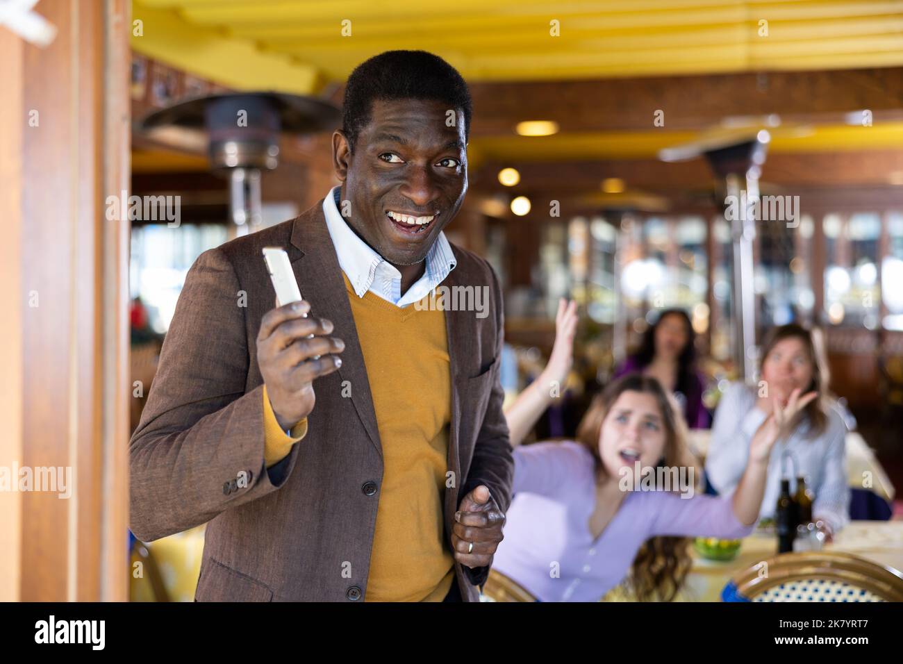 Man leaving restaurant after stealing smartphone Stock Photo - Alamy