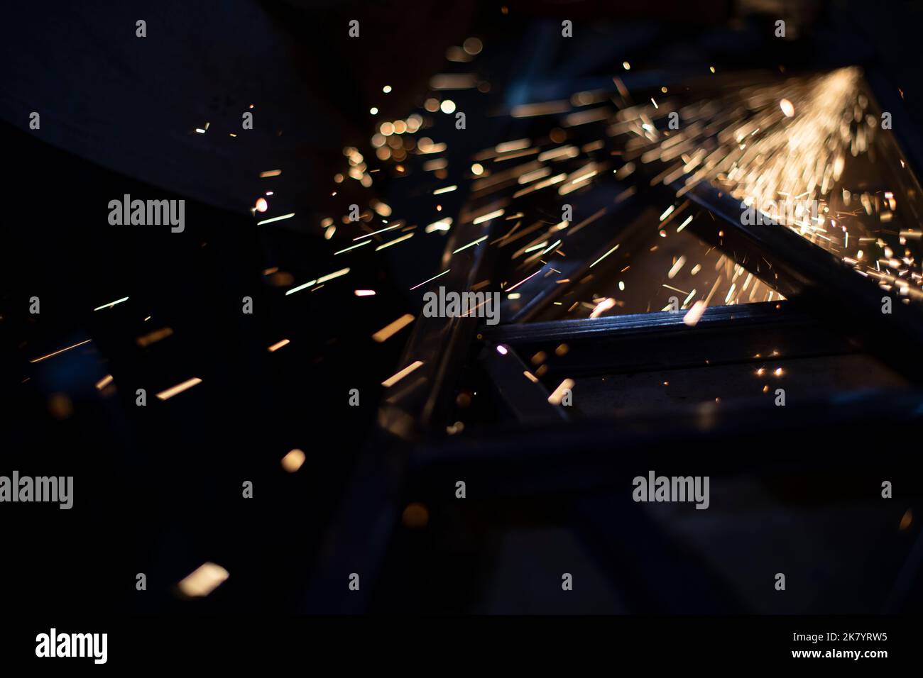 Grinding of steel. Sparks from metal. Hot particles. Small lights. Work ...
