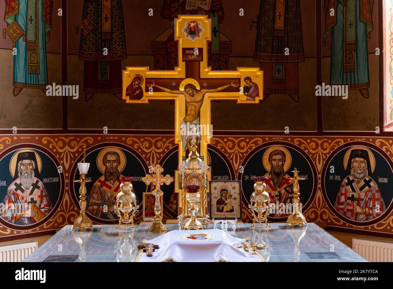 Inside the altar of an orthodox church, with traditional artifacts and the richly decorated ...