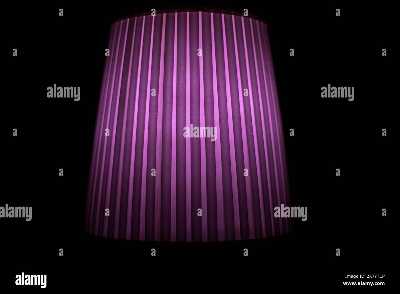 Purple lamp shade. Object in interior. Paper reflected lampshade. Rib ...