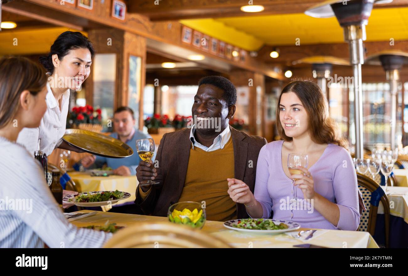 Asian waitress brought tray with restaurant guests Stock Photo - Alamy
