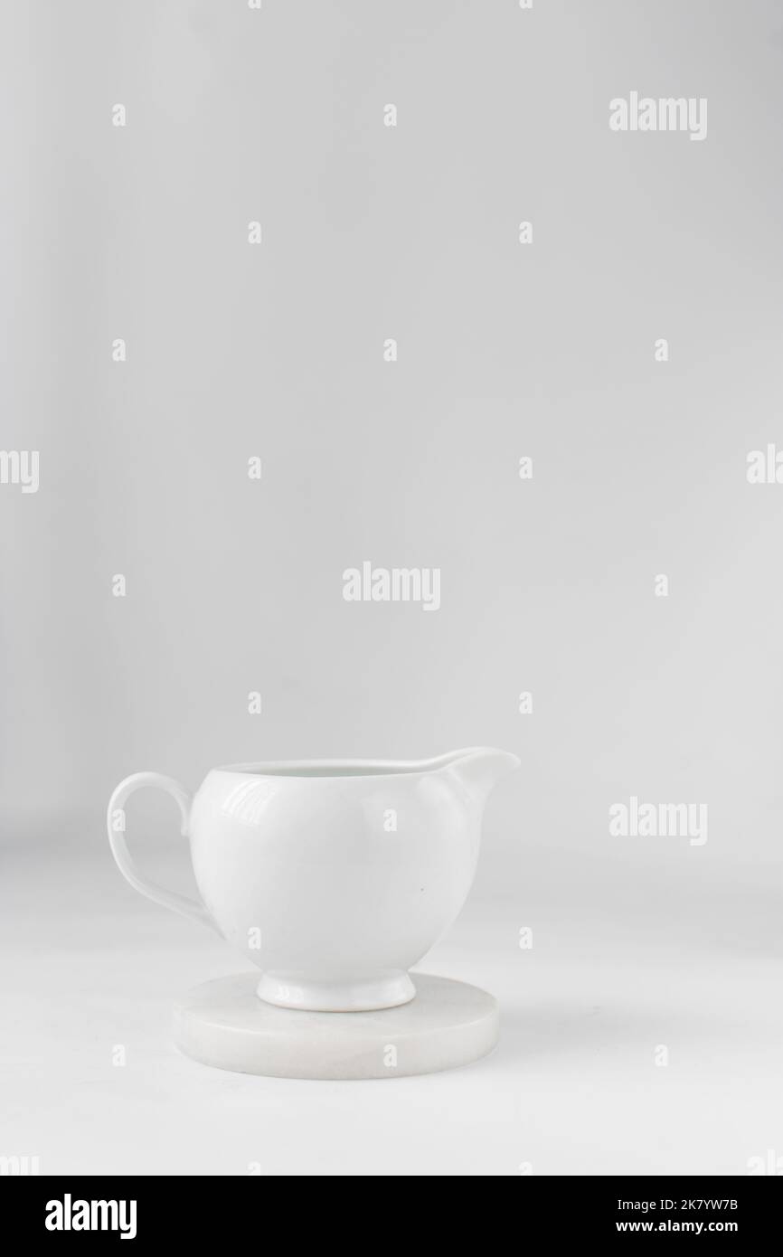 Ceramic milk jug, milk jug on a marble coaster Stock Photo - Alamy