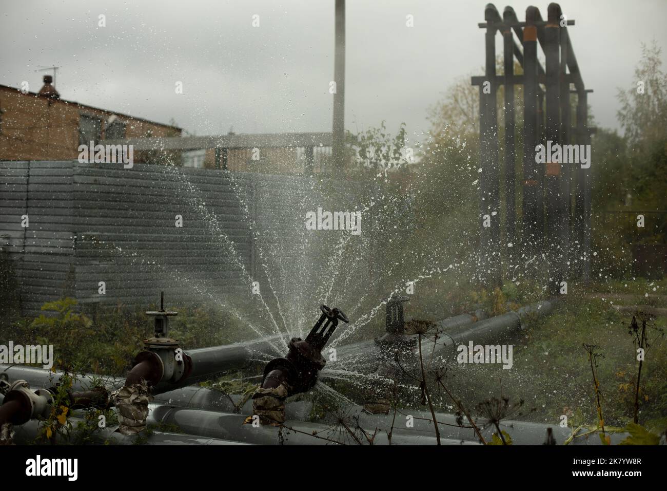 Pipe valve failure. Flow of boiling water. Steel pipe broke. Emergency ...