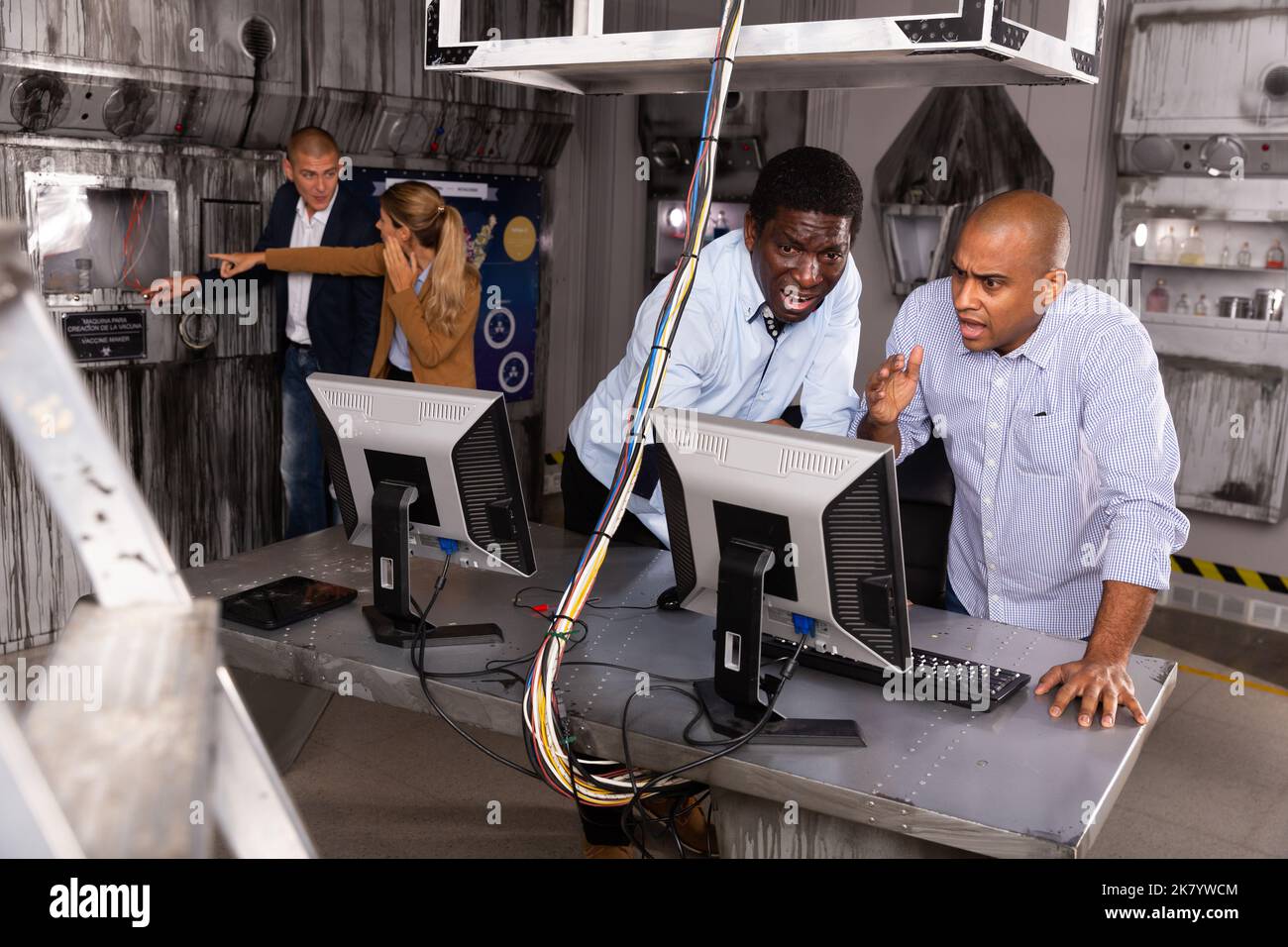 People trying to find solution of conundrum in escape room Stock Photo ...
