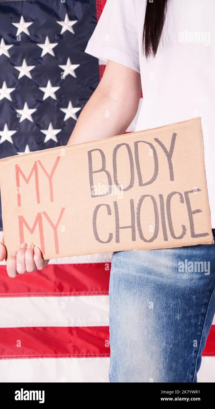 Young woman protester holds cardboard with My Body My Choice sign ...