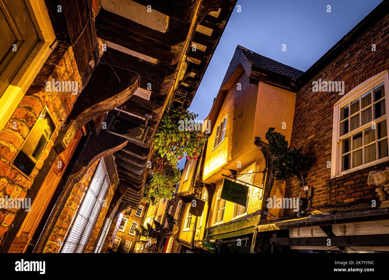A Chirstmas night view of Shambles, a historic street in York featuring ...