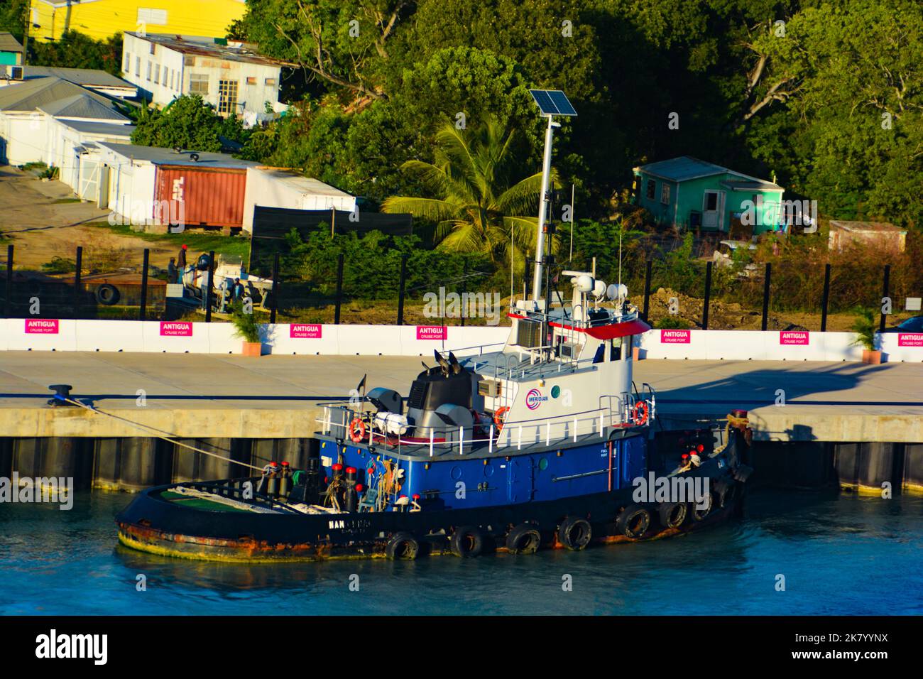 Tug boat sitting at dock Stock Photo - Alamy