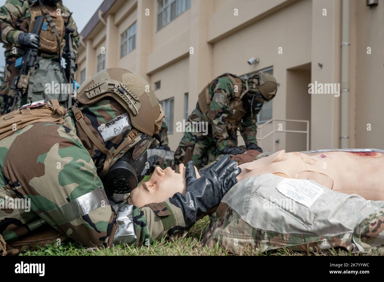 A 374th Security Forces Squadron Airman performs the jaw thrust ...