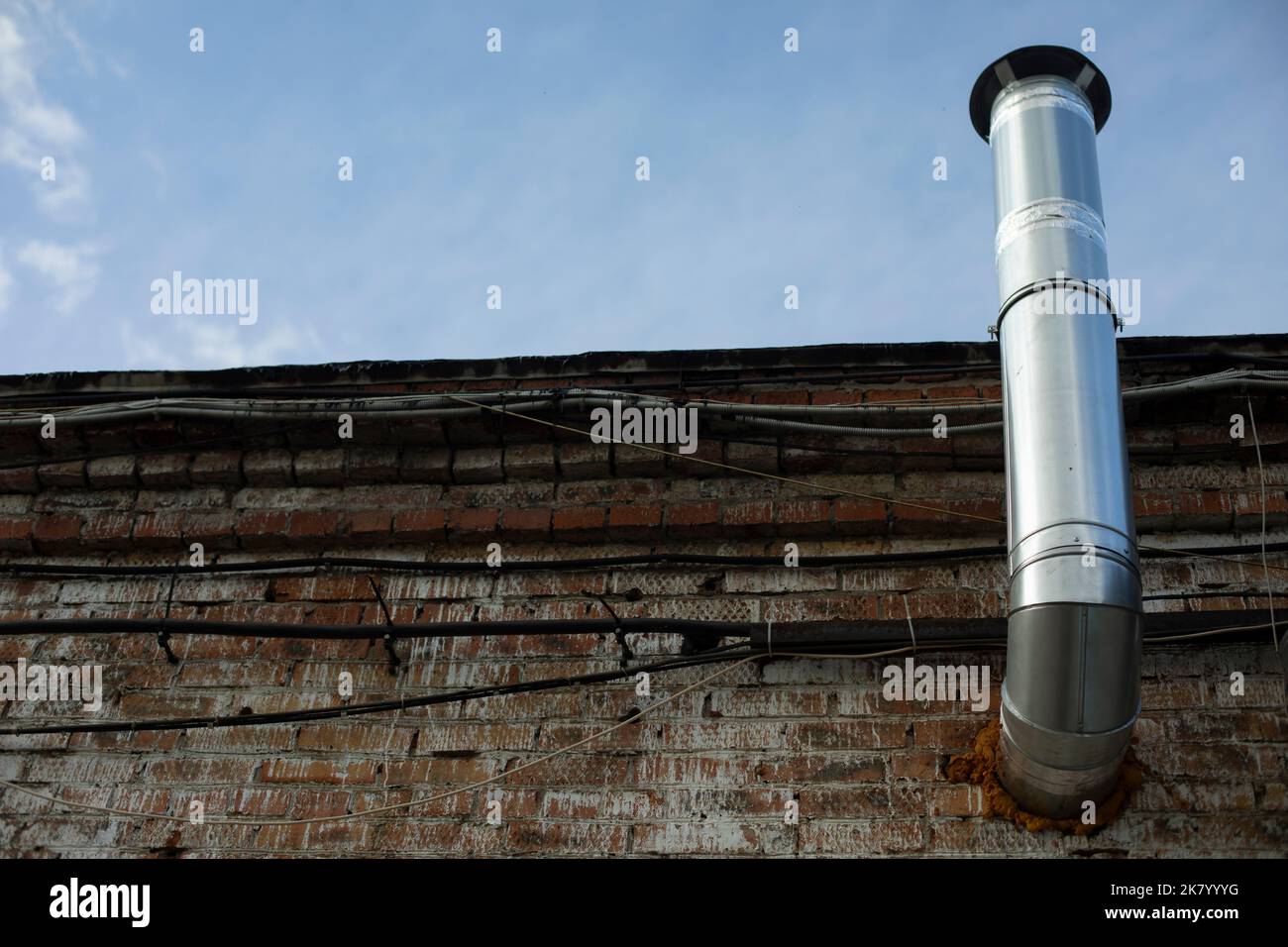 Pipe on building. Industrial building. Wall of bricks. Industrial ...