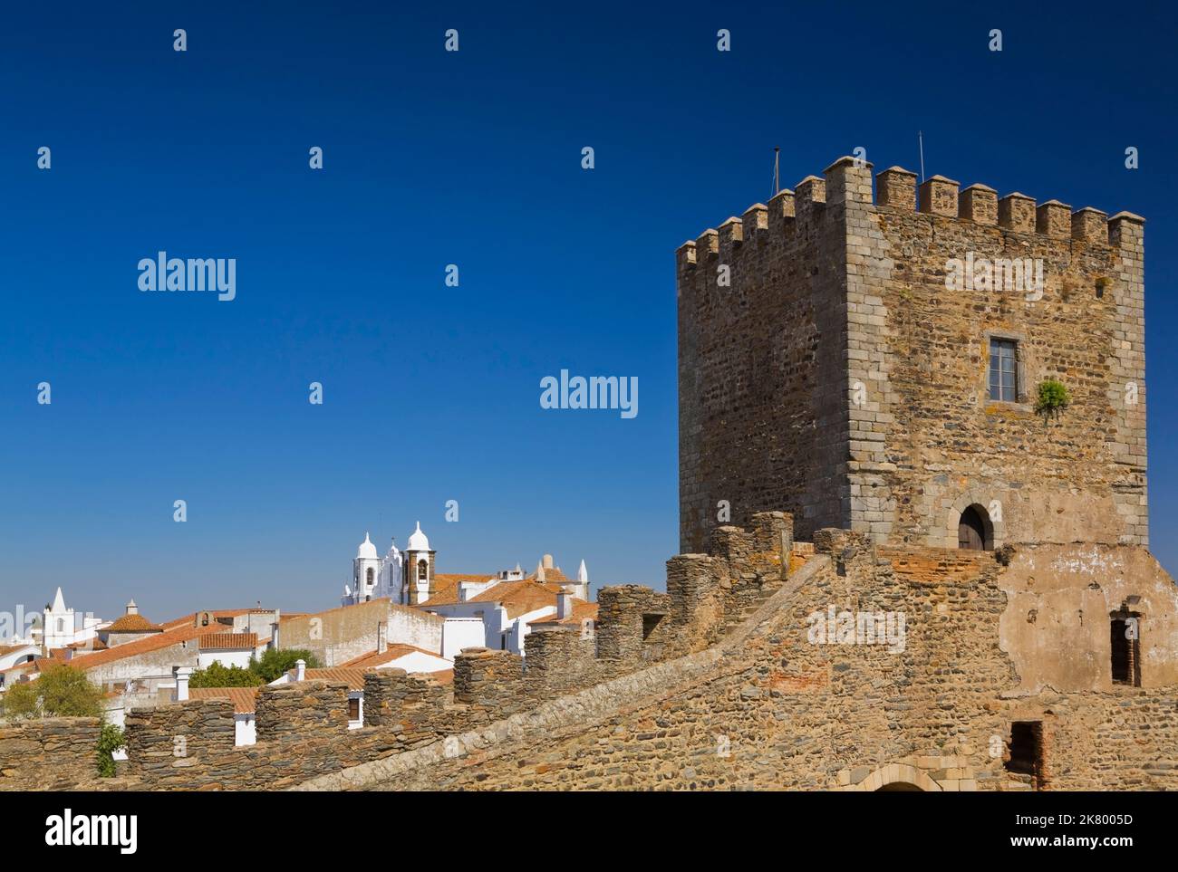 Terracotta roofed houses and churches inside the old castle walls in ...