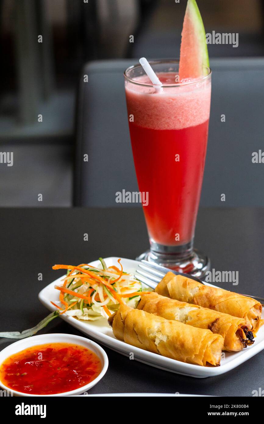 Fried spring rolls and watermelon juice combo at a local restaurant in ...