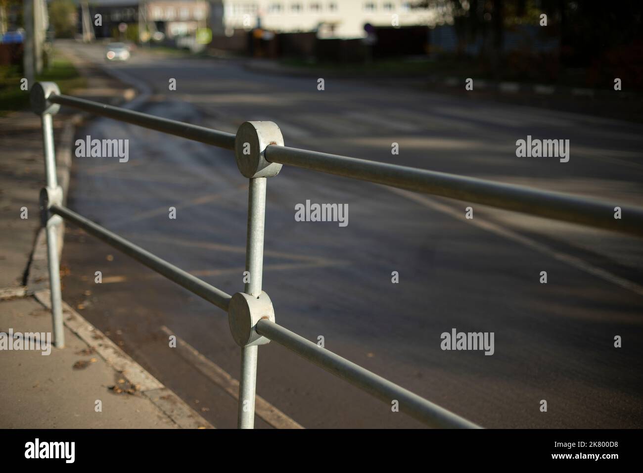 Handrail by road. Pedestrian barrier. Fence along road. Fencing details ...