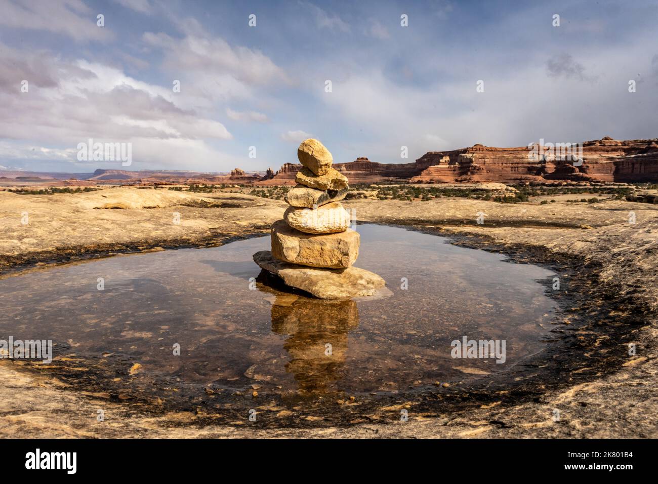 Cairn Stacked in Pool of Pothole on a rock in the Needles district of ...