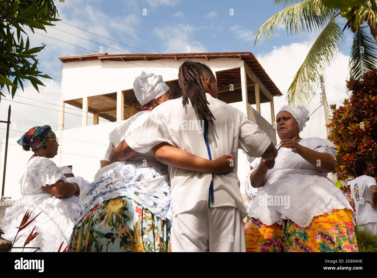 Candomblé members gathered in traditional clothing at the religious ...