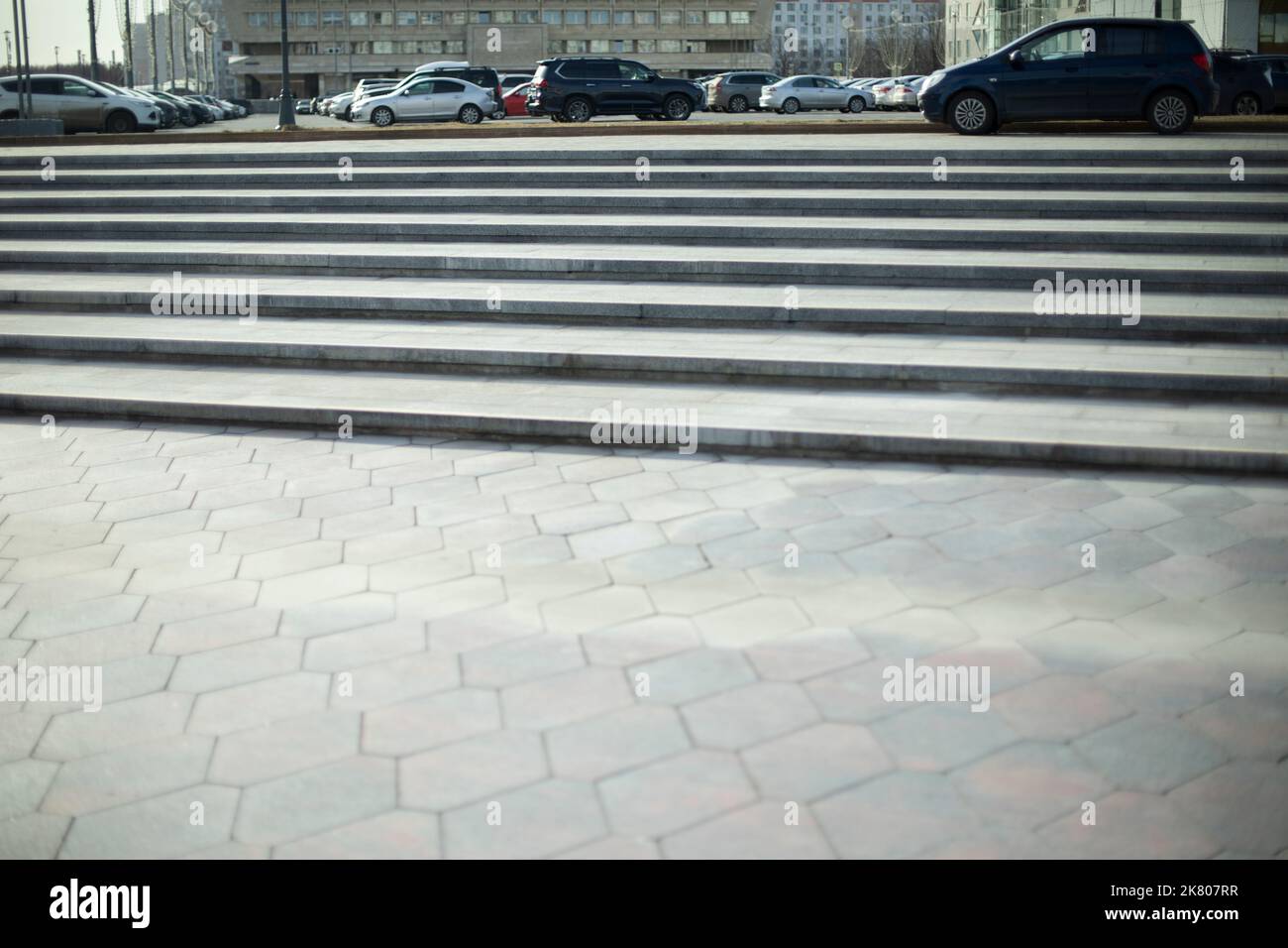 Long stone steps in city. Details of urban environment. Stairs outside ...