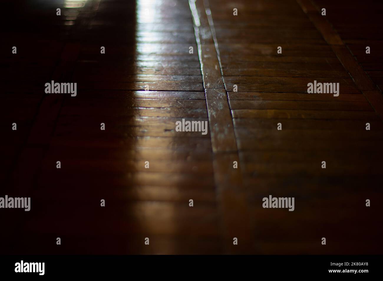 Parquet on floor. Light on floor. Details of old interior. Light from ...