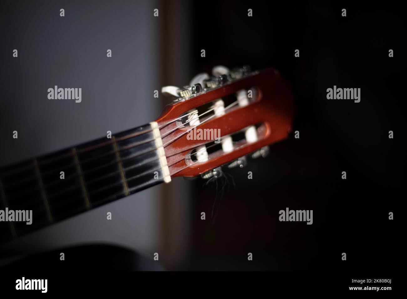 Acoustic guitar six strings. Old guitar in sunlight. Details of musical ...