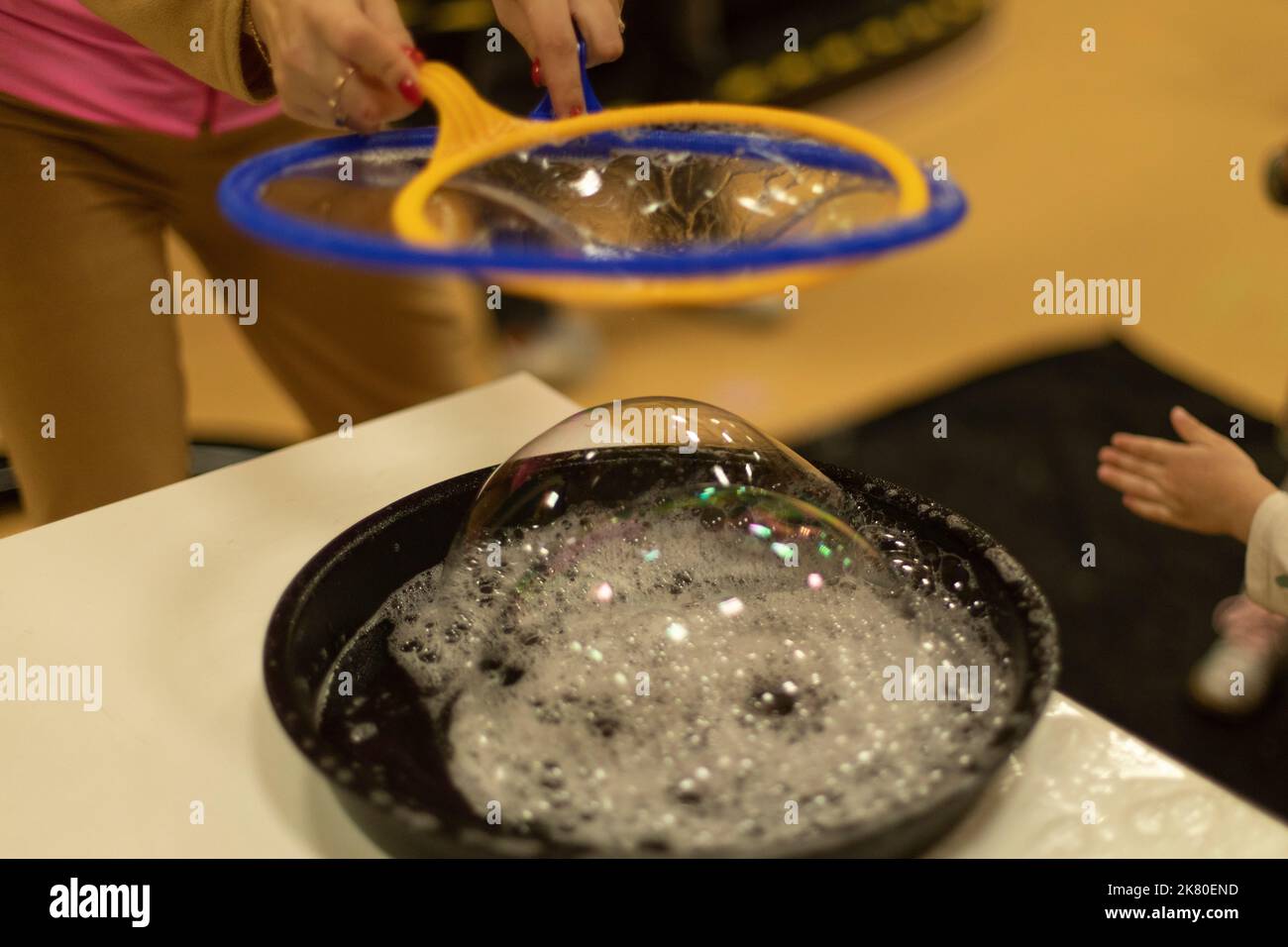 Bubbles. Soap solution for inflatable bubbles. Liquid for entertainment ...