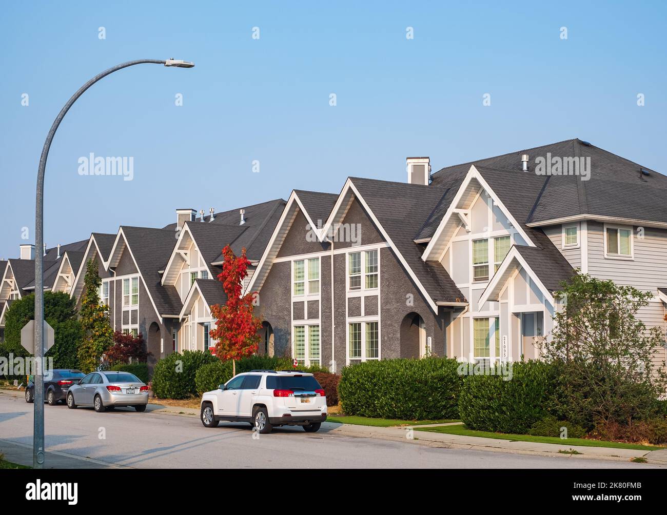 Neighborhood modern houses building in BC, Canada. Canadian modern residential architecture, low ...