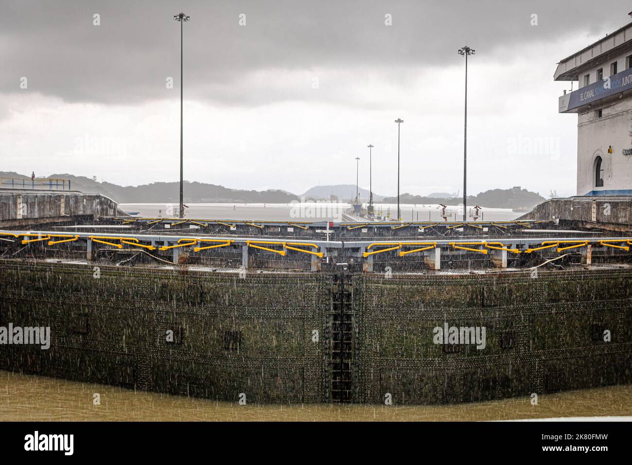 Panama Canal at the Pedro Miguel Locks. Image shows the view of passing ...