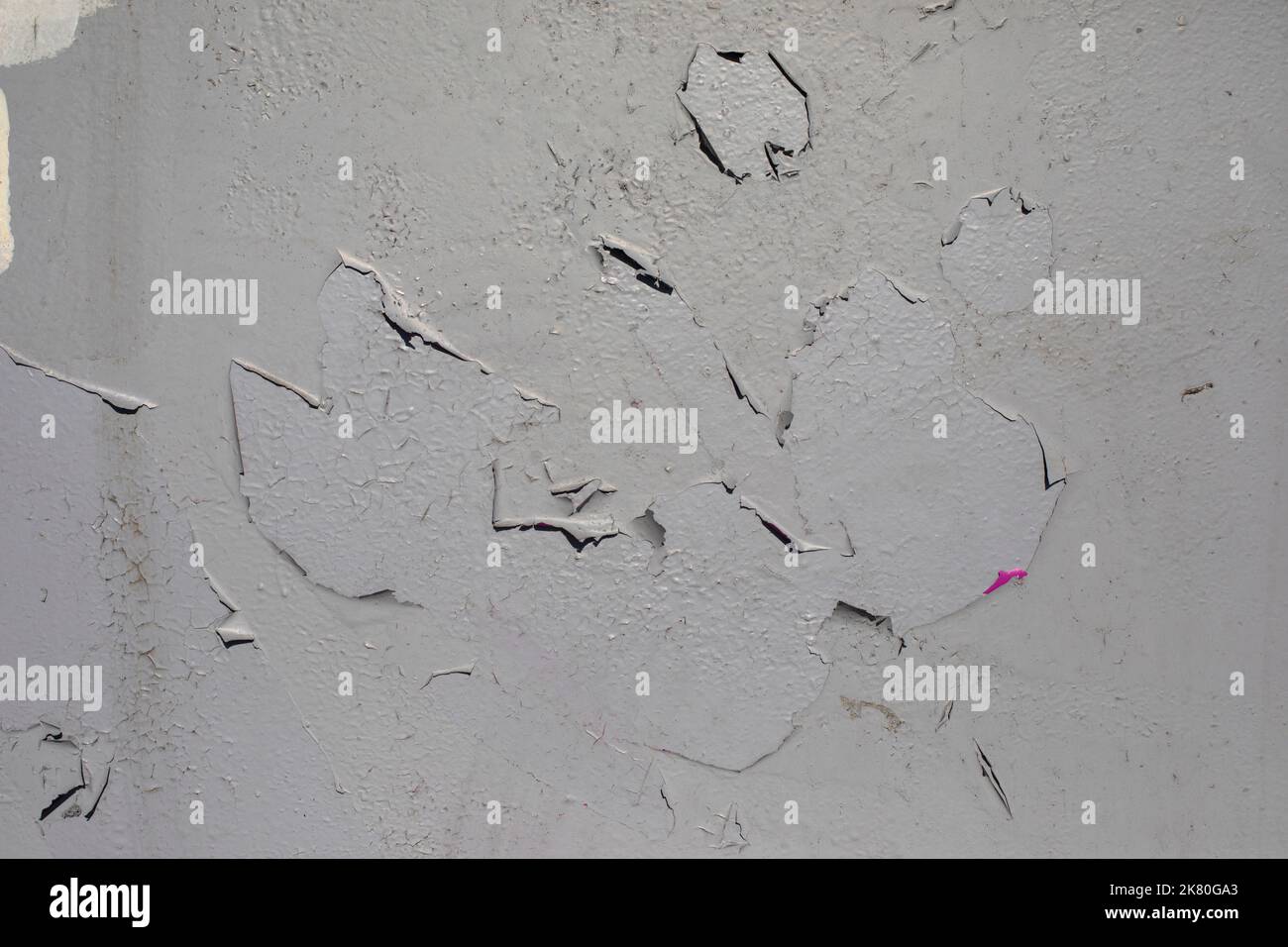 Texture of wall is in gray paint. Poorly painted wall surface. Uneven ...