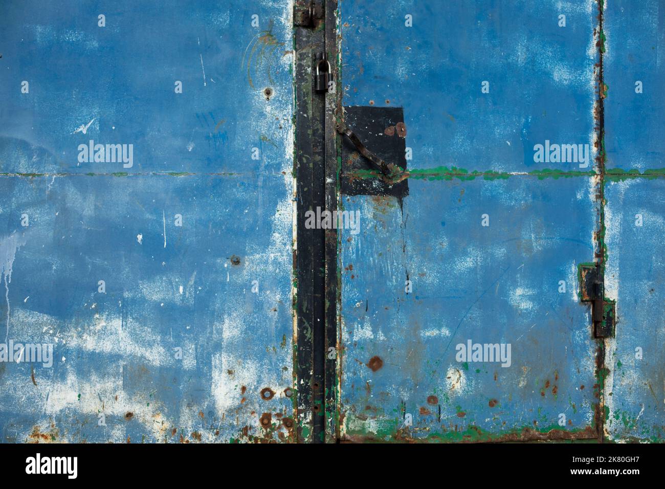 Old blue gate. Details of industrial area. Truck transport. Blue steel ...