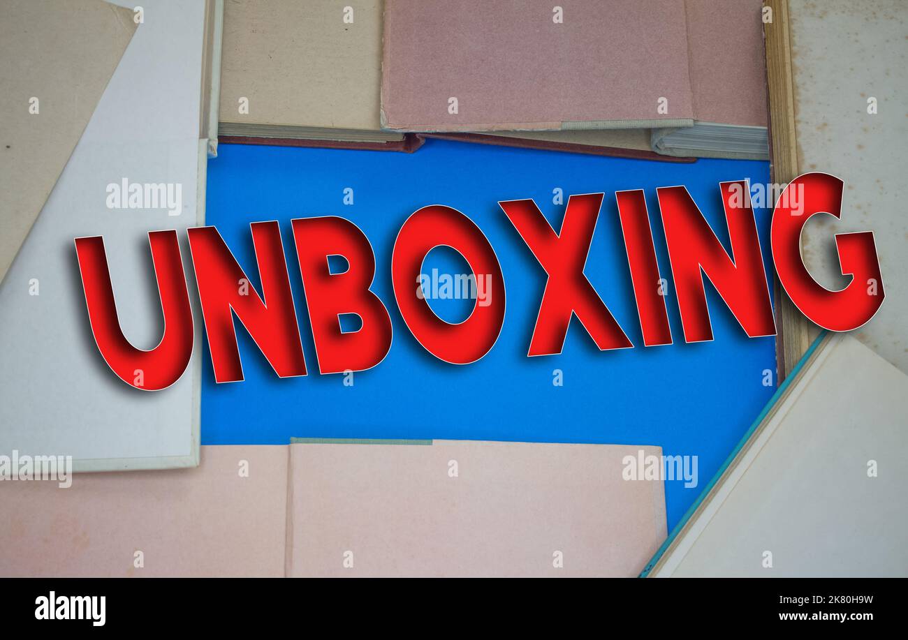 Unboxing word in opened book with vintage, natural patterns old antique ...